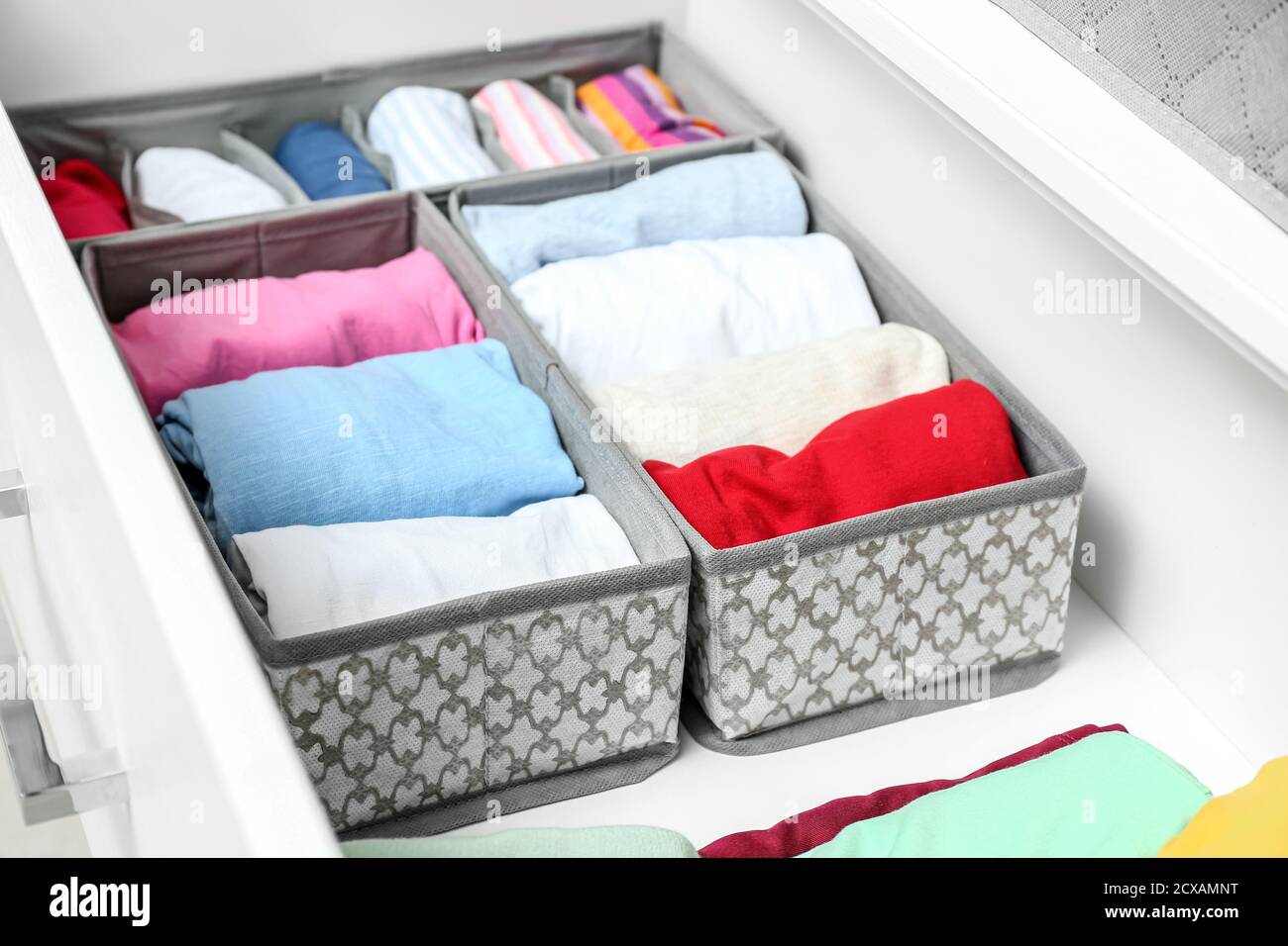 Open drawer with clean clothes in closet Stock Photo - Alamy