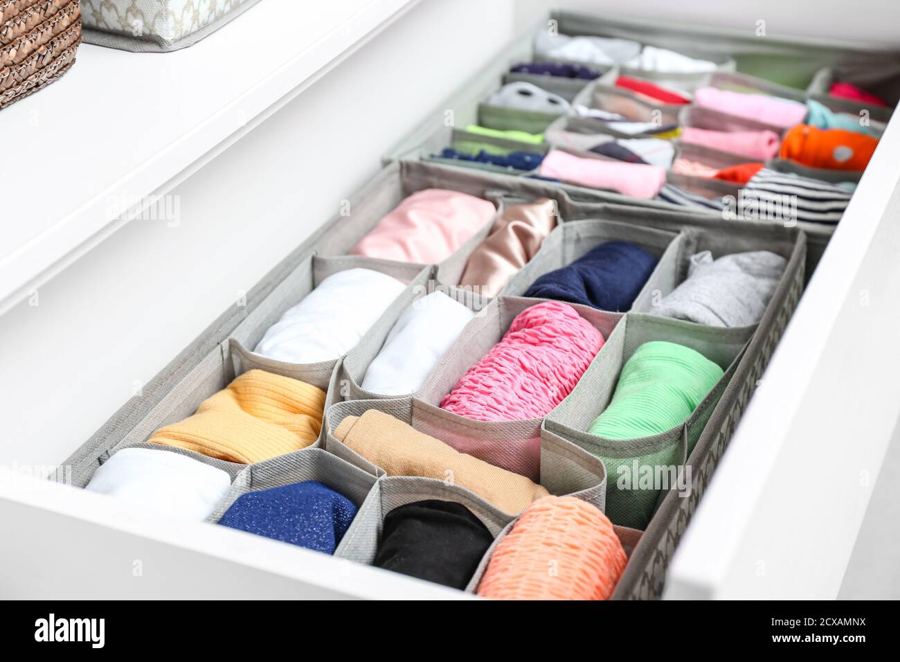 Open drawer with clean clothes in closet Stock Photo - Alamy