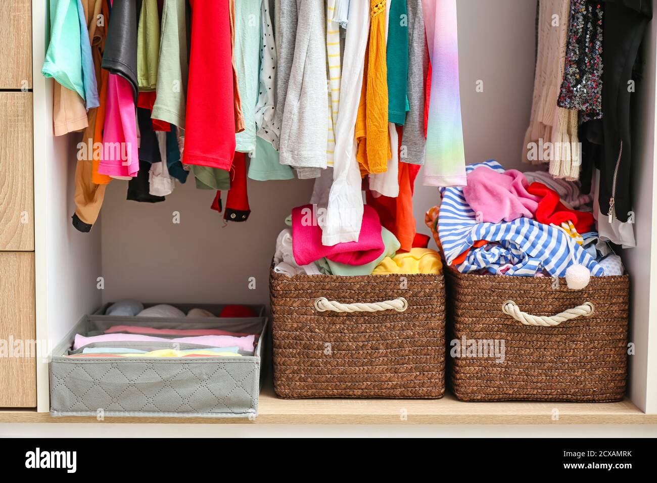 Modern wardrobe with clean clothes Stock Photo - Alamy