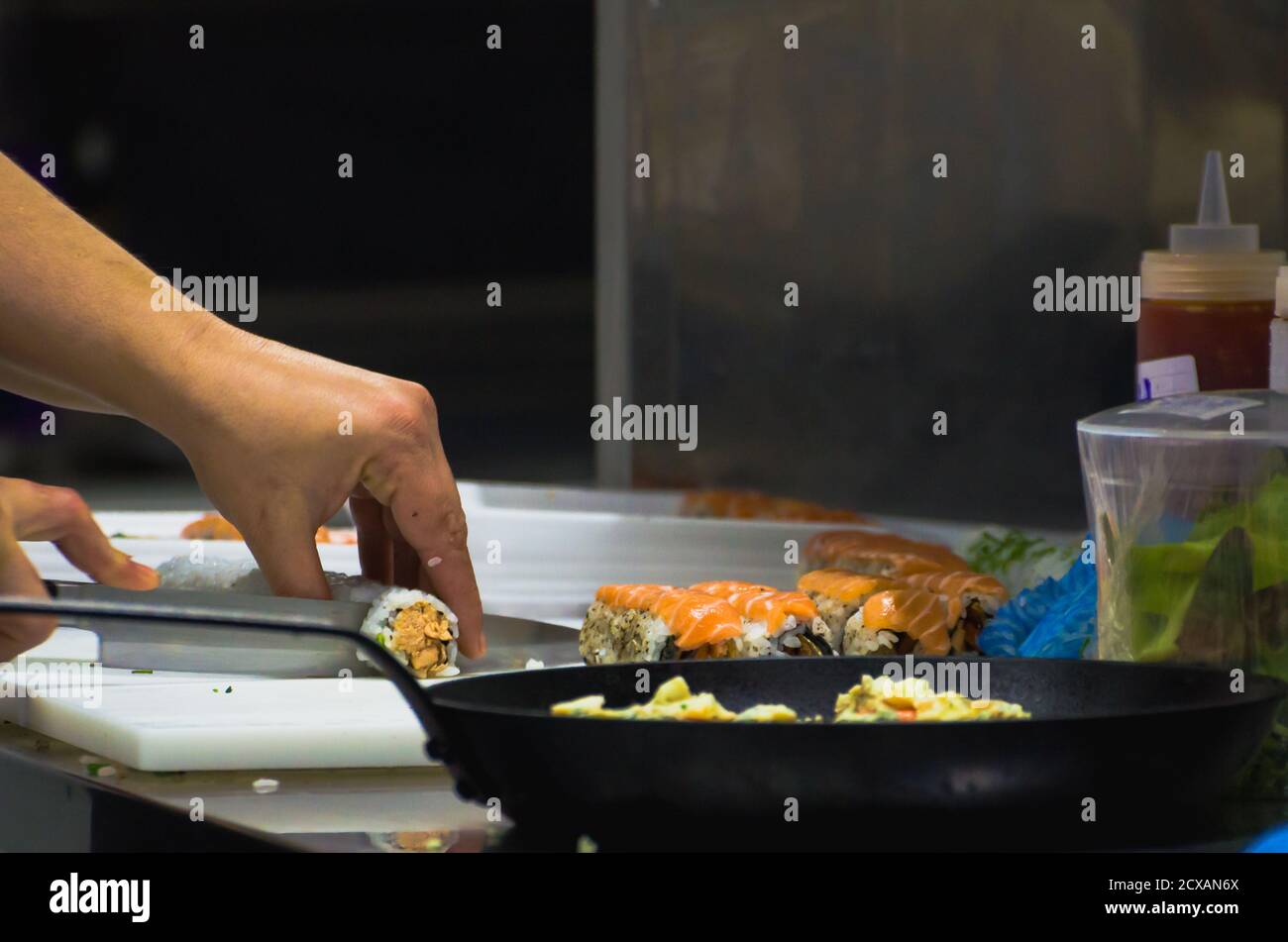 Closeup of chef hands preparing japanese food. Japanese chef making ...