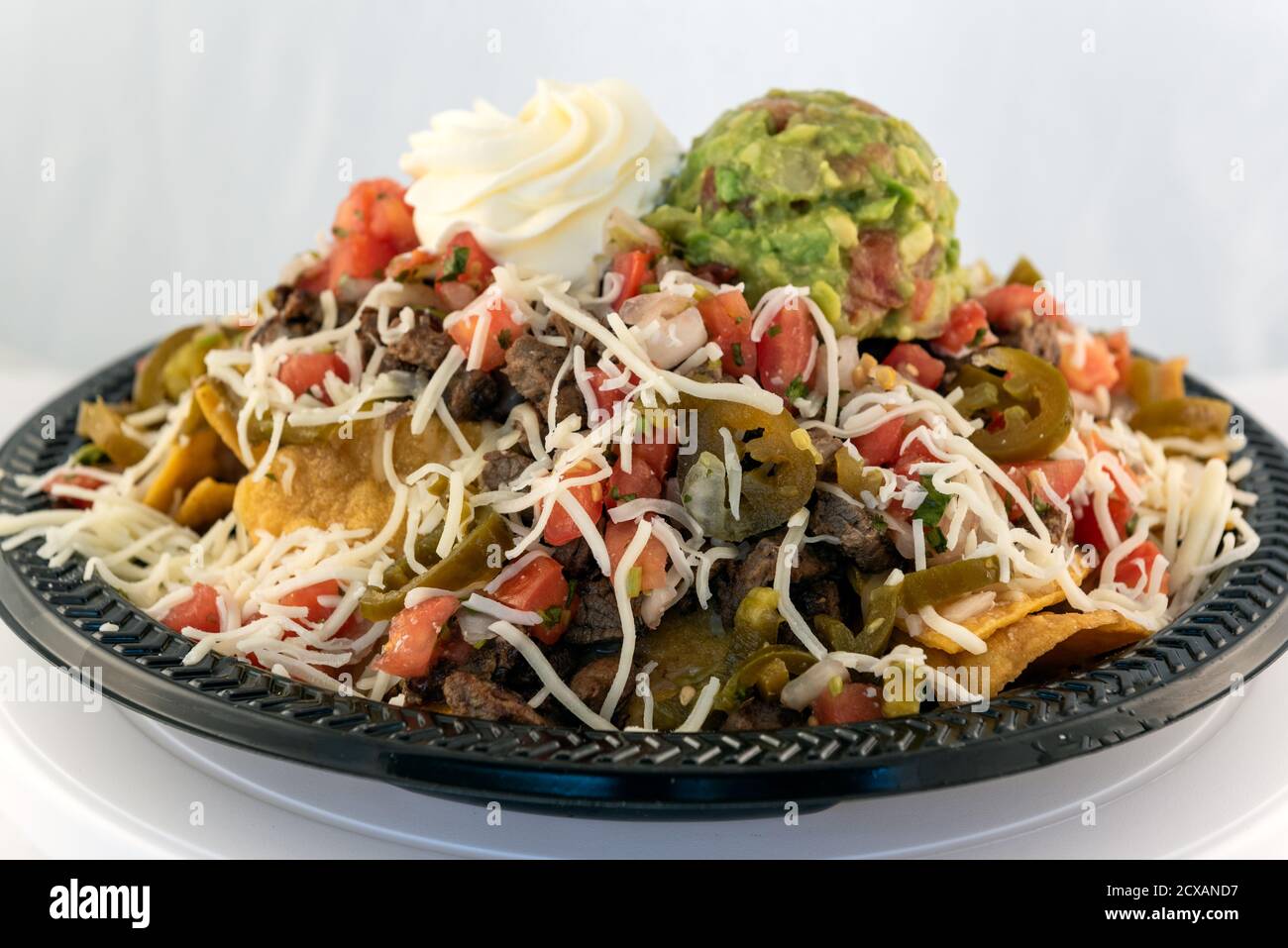 Hearty meal of carne asada nachos tempts the taste buds to eat the ...
