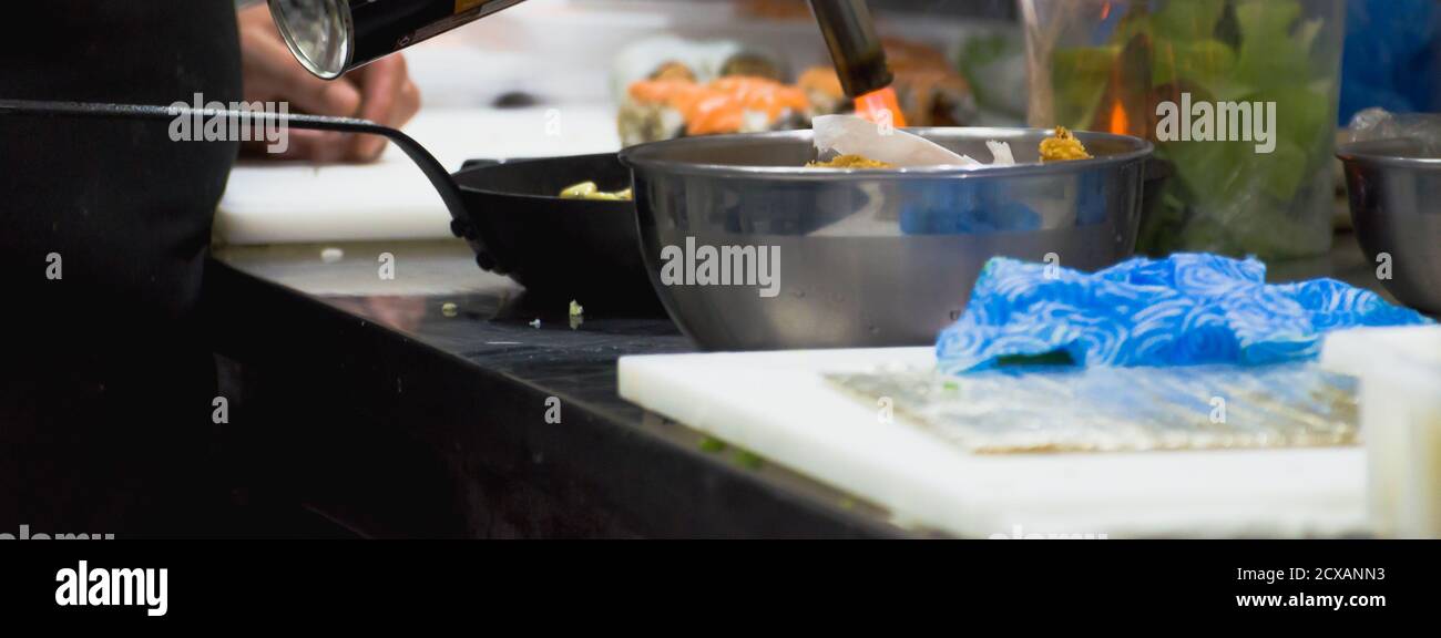 Young chef making traditional japanese hi-res stock photography and ...