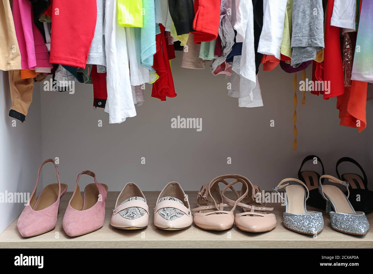 Modern wardrobe with clean clothes and shoes Stock Photo - Alamy