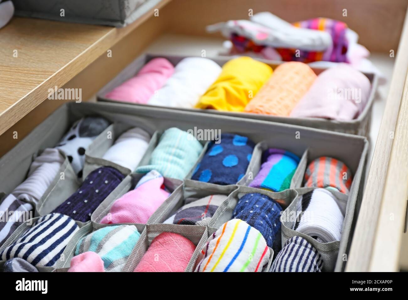 Open drawer with clean clothes in closet Stock Photo - Alamy