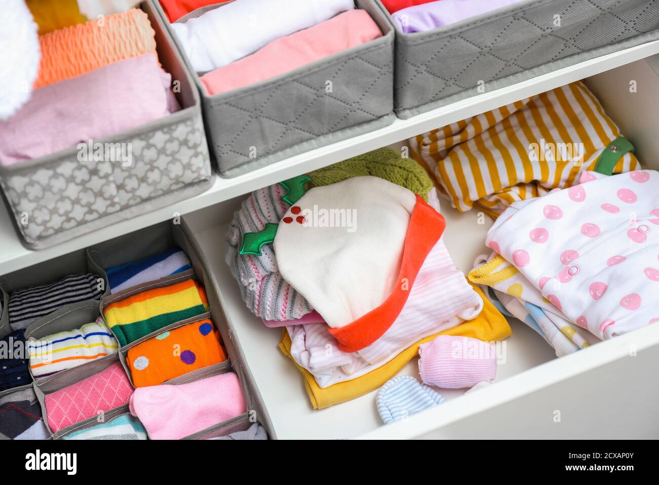 Open drawer with clean clothes in closet Stock Photo - Alamy