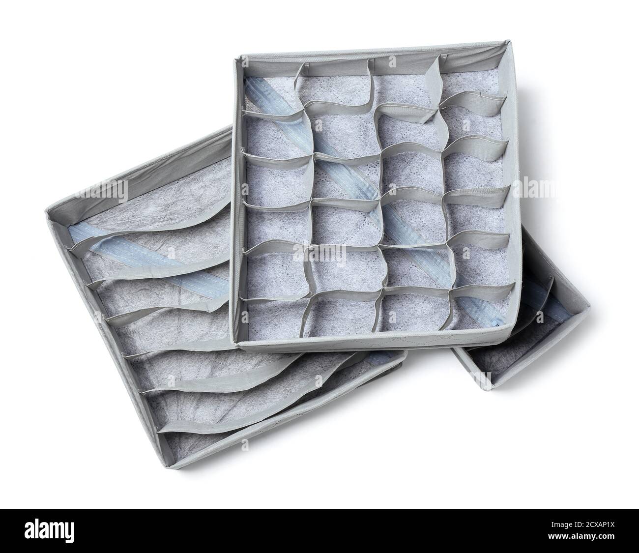 Empty organizers for clean clothes on white background Stock Photo - Alamy