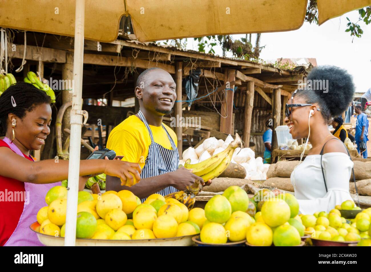 a young handsome african man feeling excited as he sells to his ...
