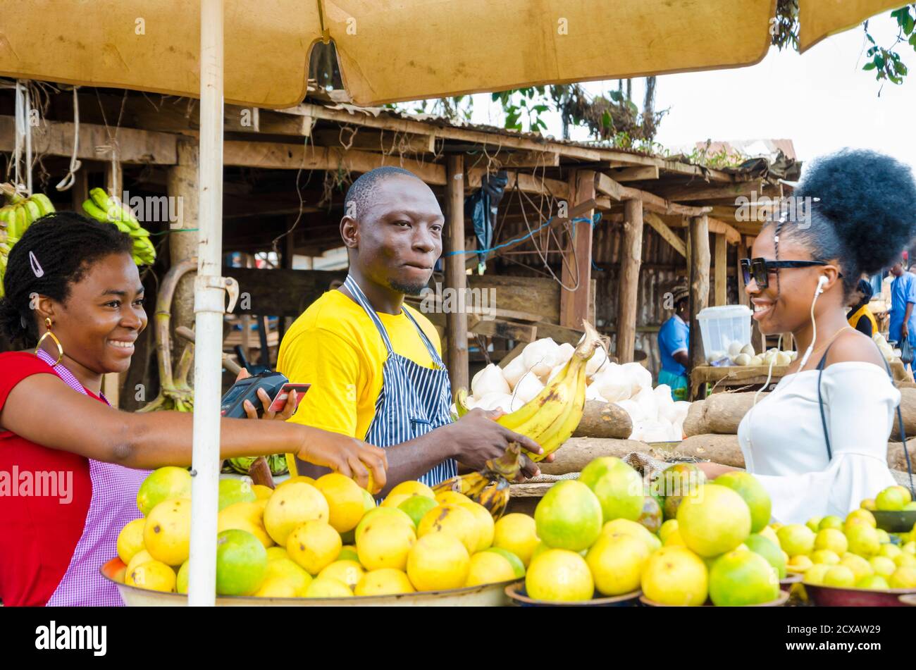a young handsome african man feeling excited as he sells to his ...