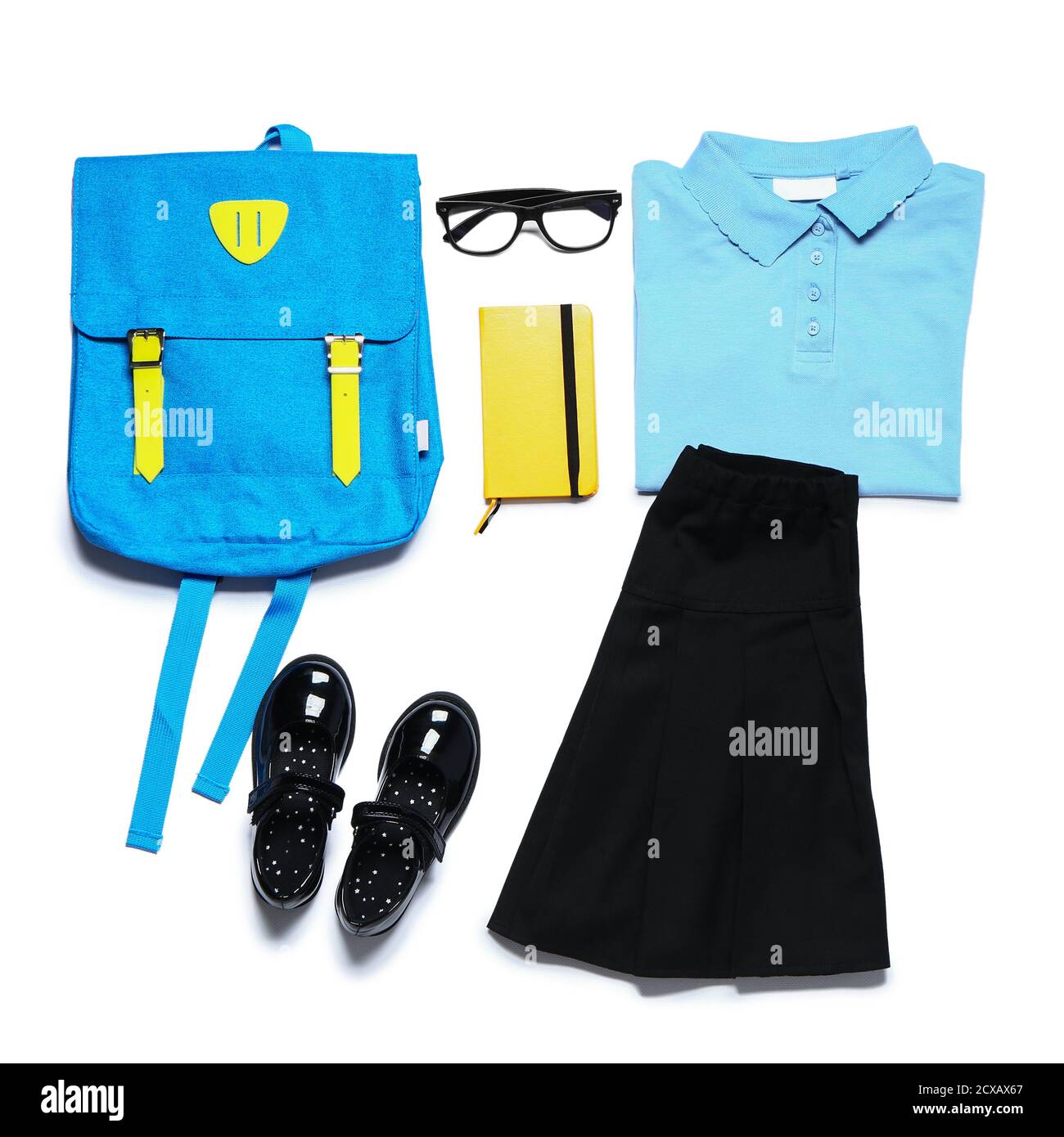 Stylish school uniform with backpack on white background Stock Photo ...