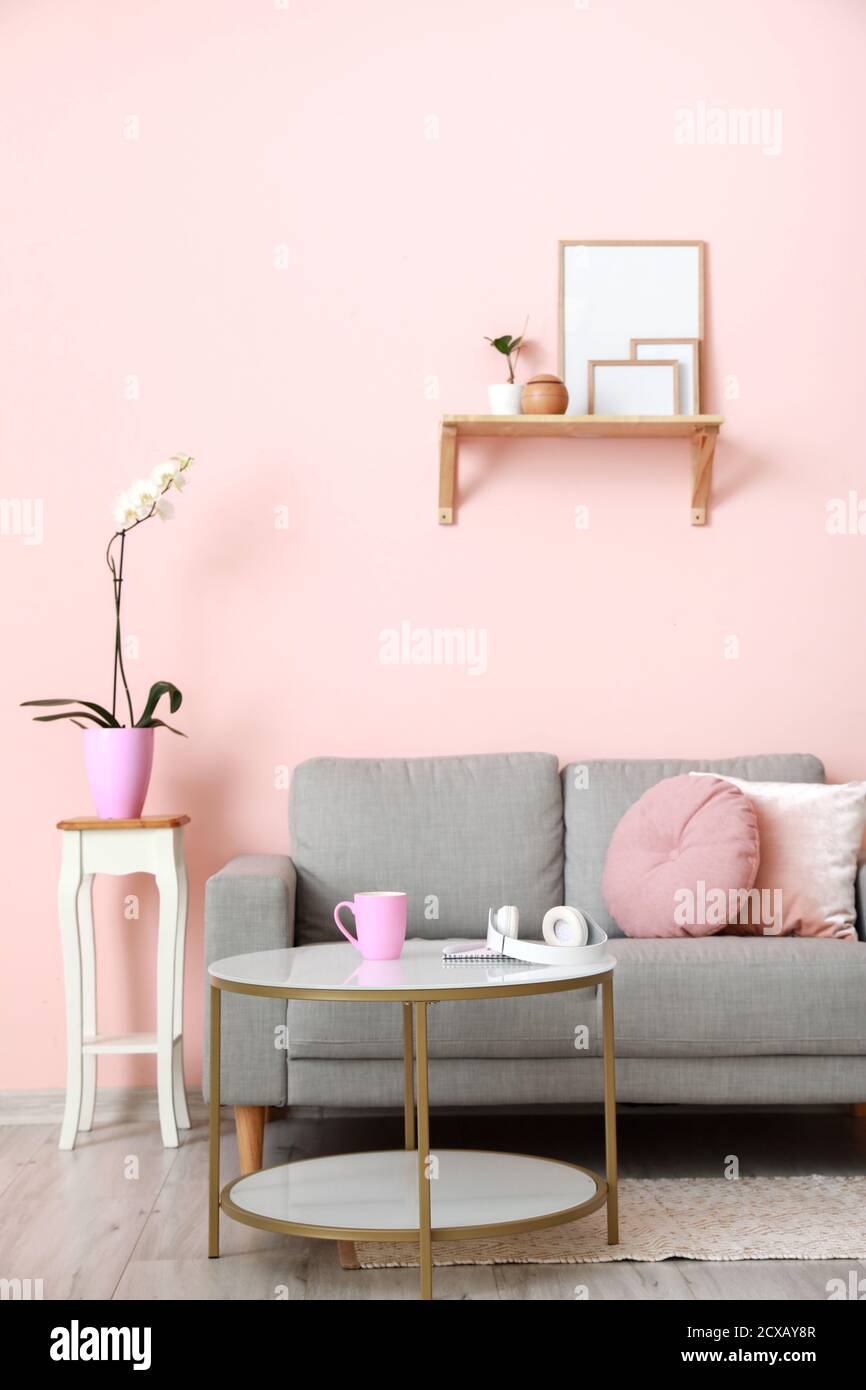 Interior of modern room with sofa and table Stock Photo - Alamy