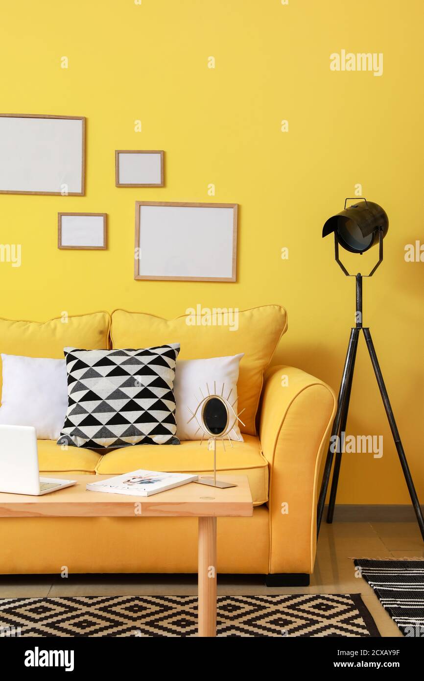 Interior of modern room with comfortable sofa Stock Photo - Alamy