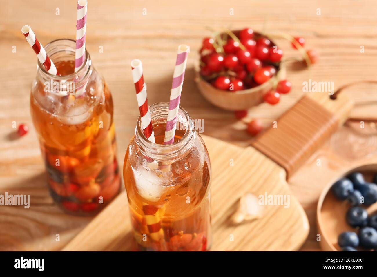 Bottles of fresh ice tea on table Stock Photo - Alamy