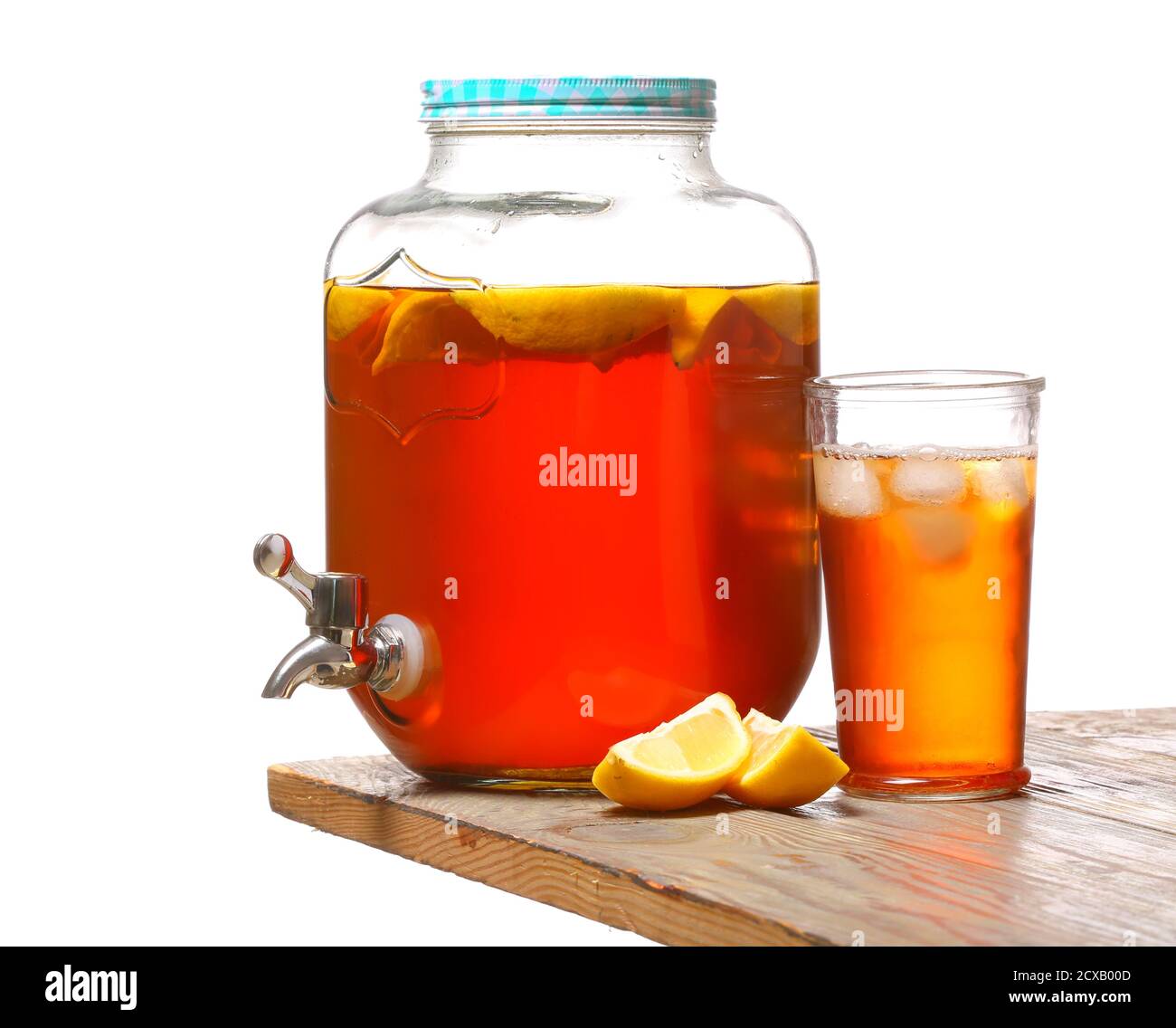 Jar and glass of fresh ice tea on table against white background Stock ...