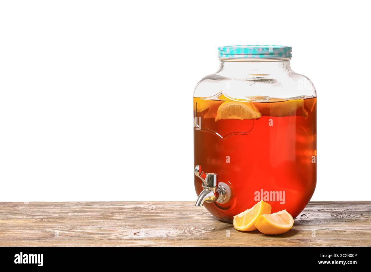 Jar of fresh ice tea on table against white background Stock Photo - Alamy