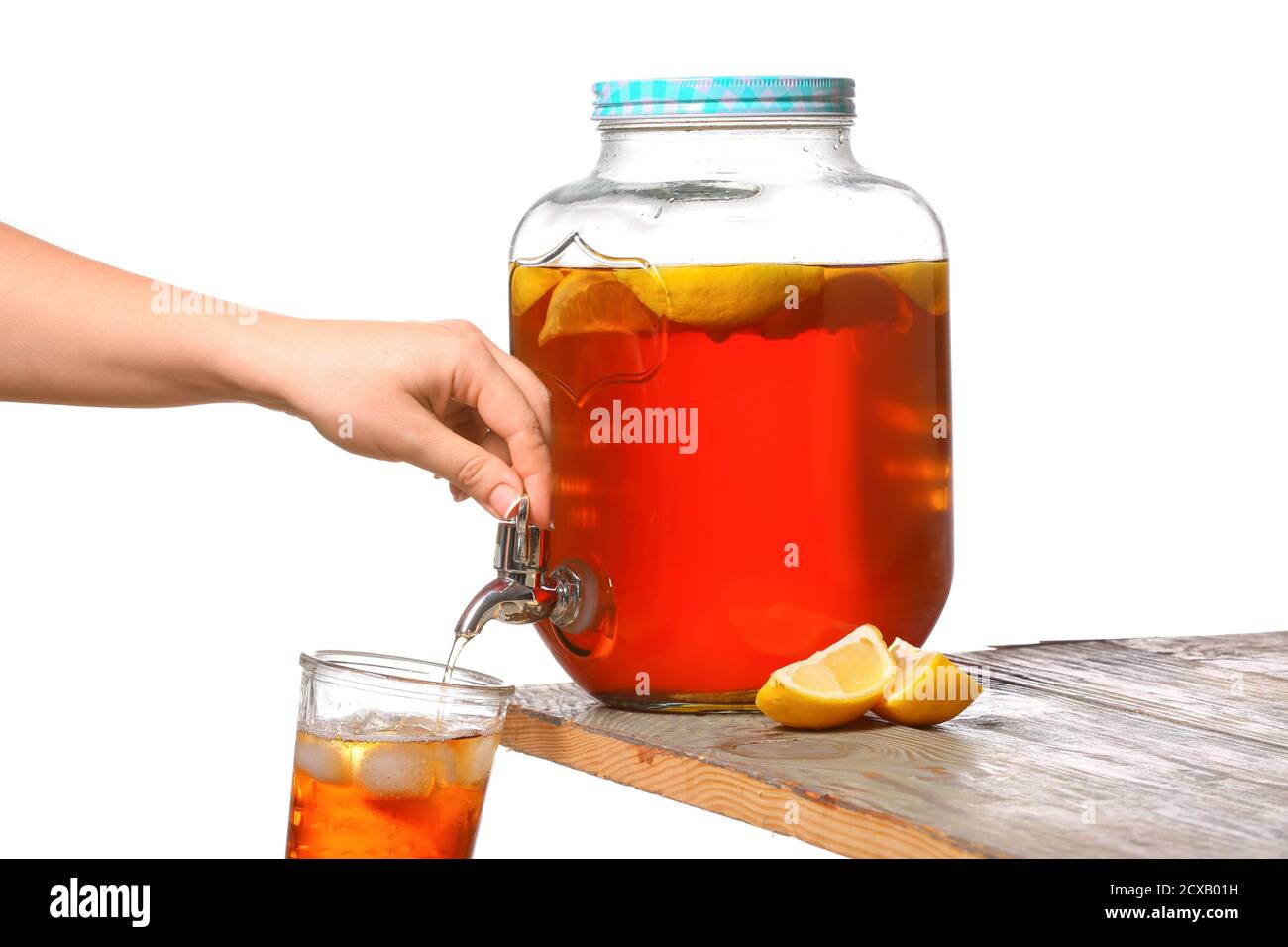 Woman pouring fresh ice tea in glass against white background Stock ...