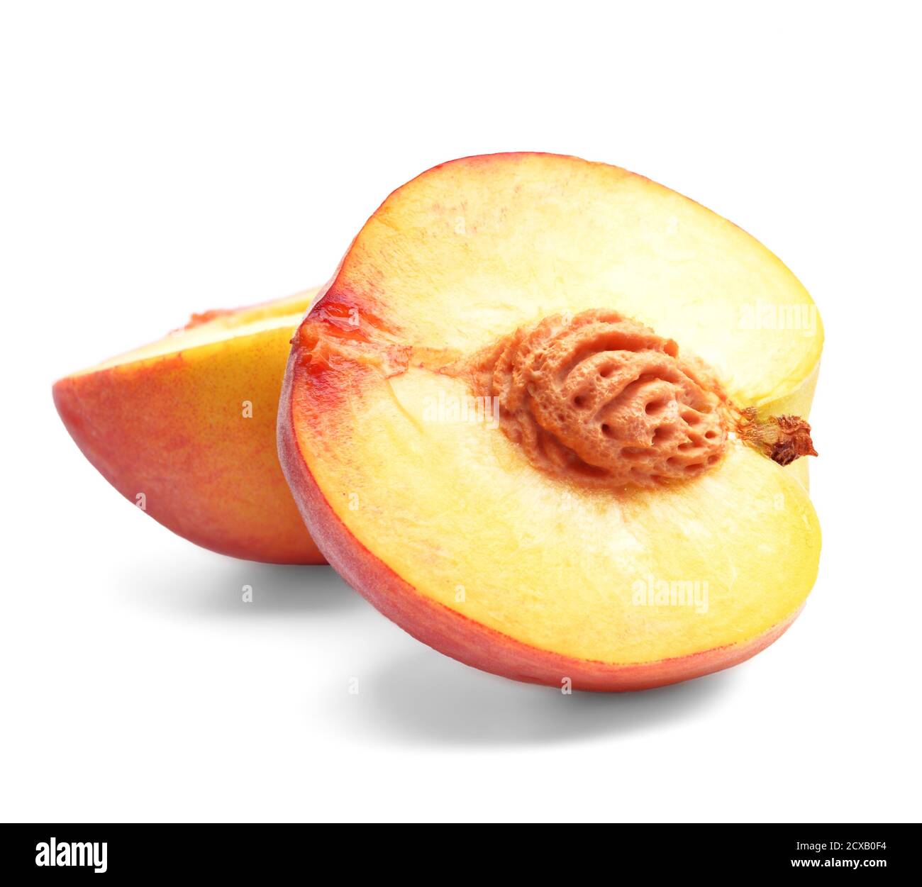 Sweet cut peach on white background Stock Photo - Alamy