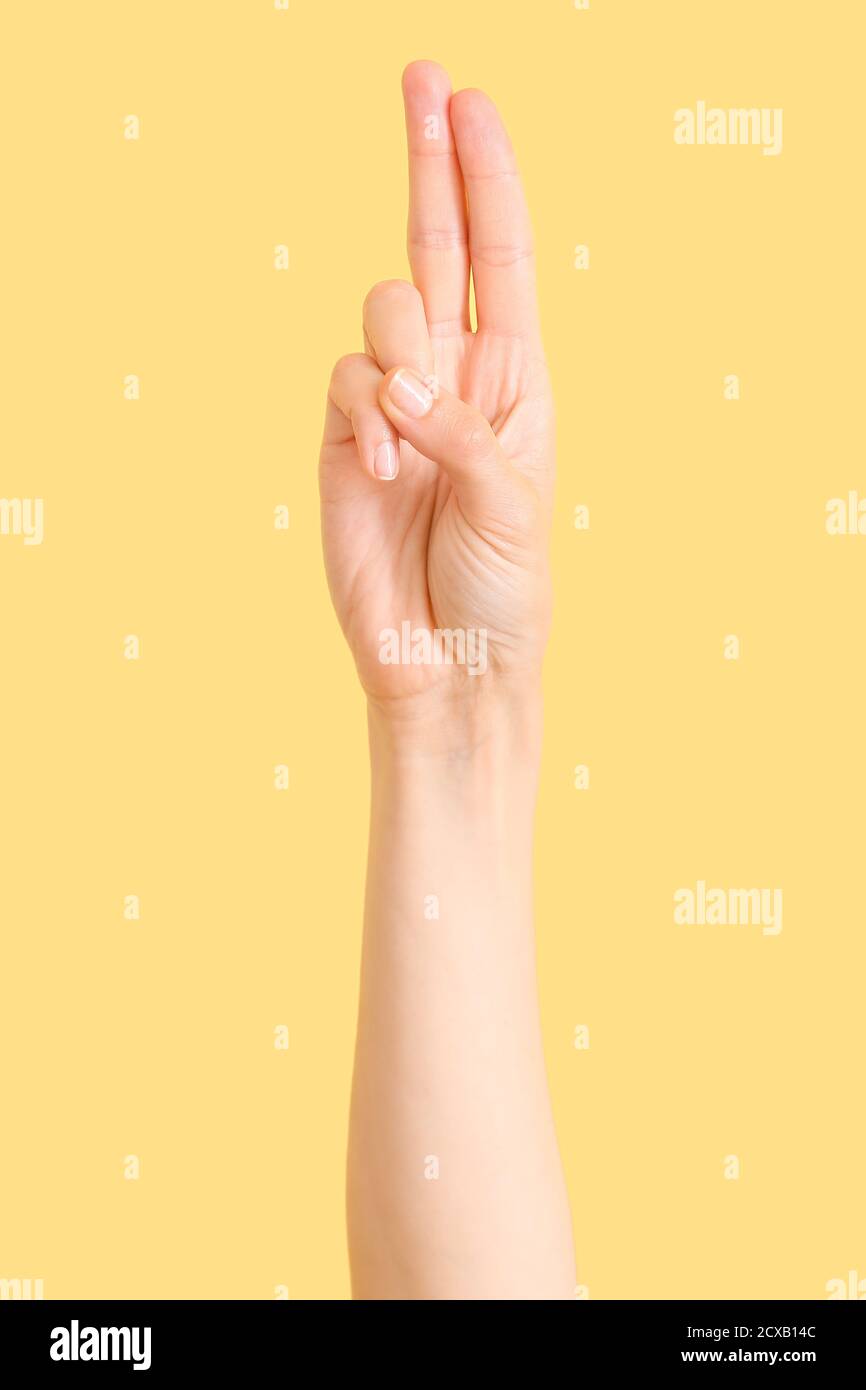 Hand showing letter U on color background. Sign language alphabet Stock ...