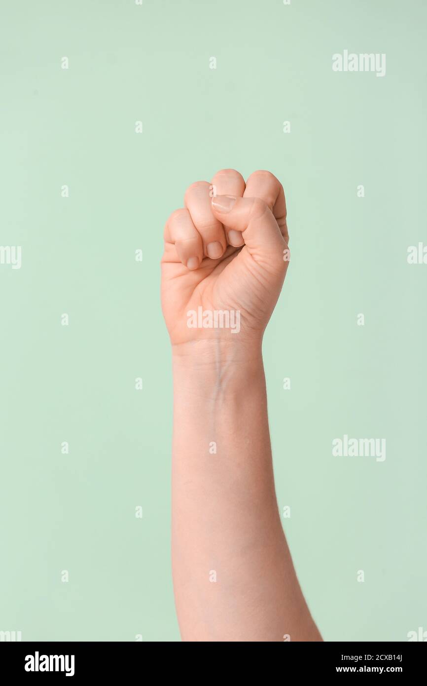 Hand showing letter S on color background. Sign language alphabet Stock ...
