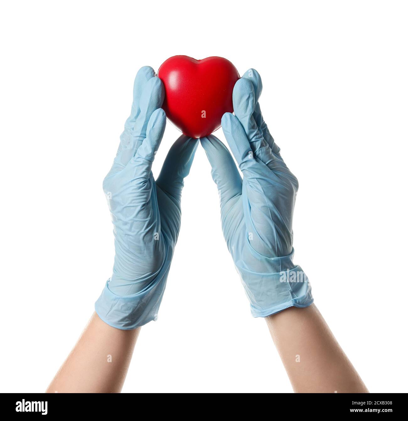 Hands of doctor with heart on white background. Cardiology concept ...