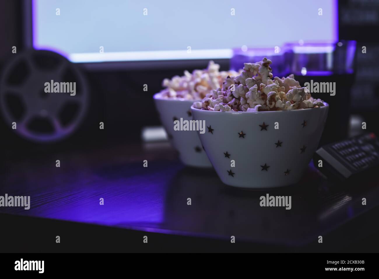 Popcorn in bowls on table in room Stock Photo - Alamy