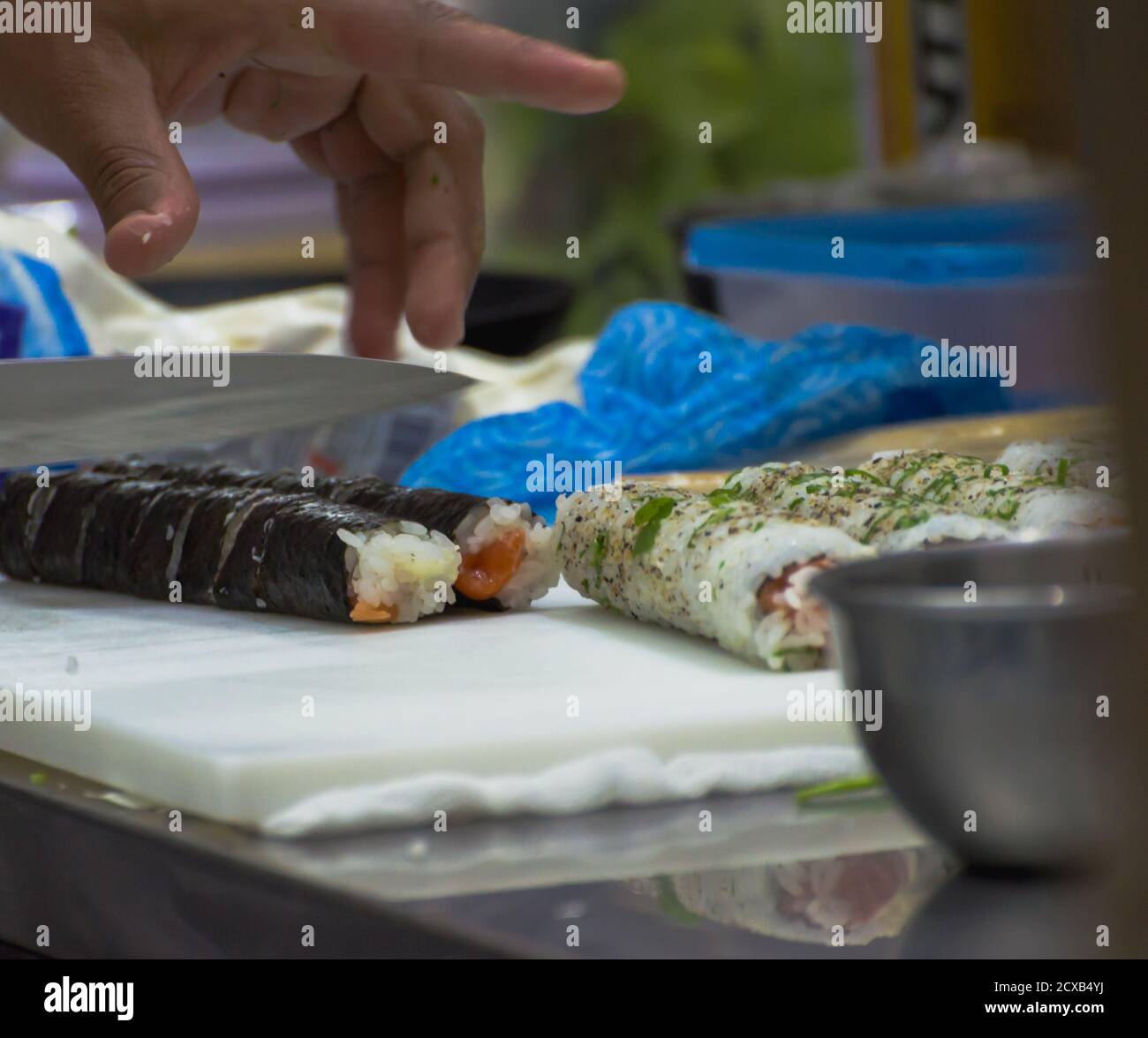 Closeup of chef hands preparing japanese food. Japanese chef making ...