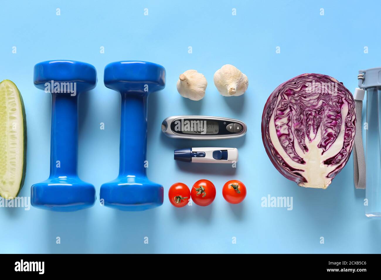Vegetables, dumbbells, lancet pen and glucometer on color background ...