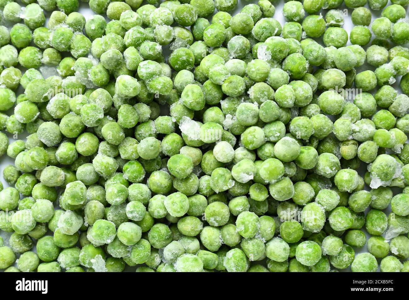 Frozen green peas as background Stock Photo - Alamy
