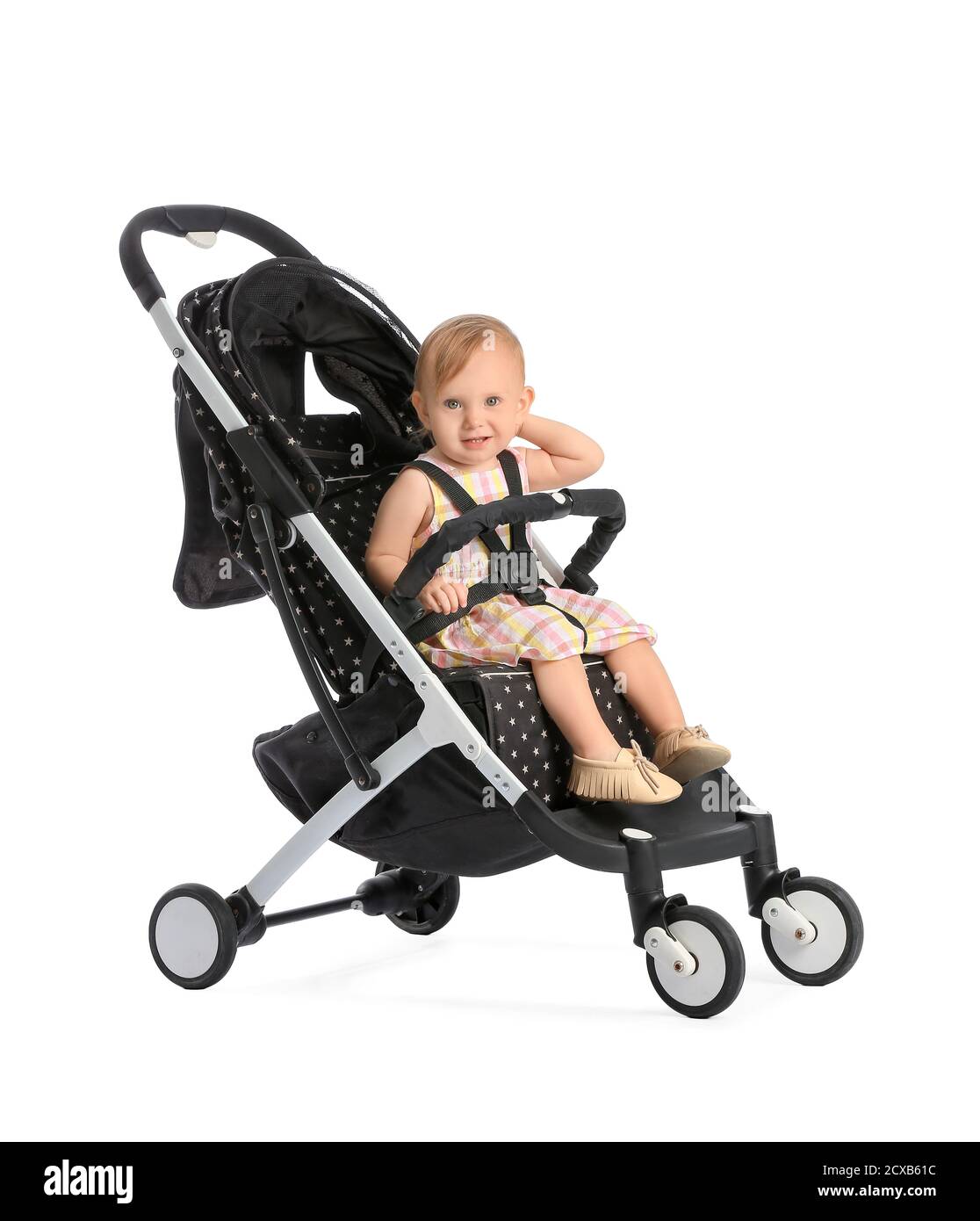 Cute little baby in stroller on white background Stock Photo - Alamy