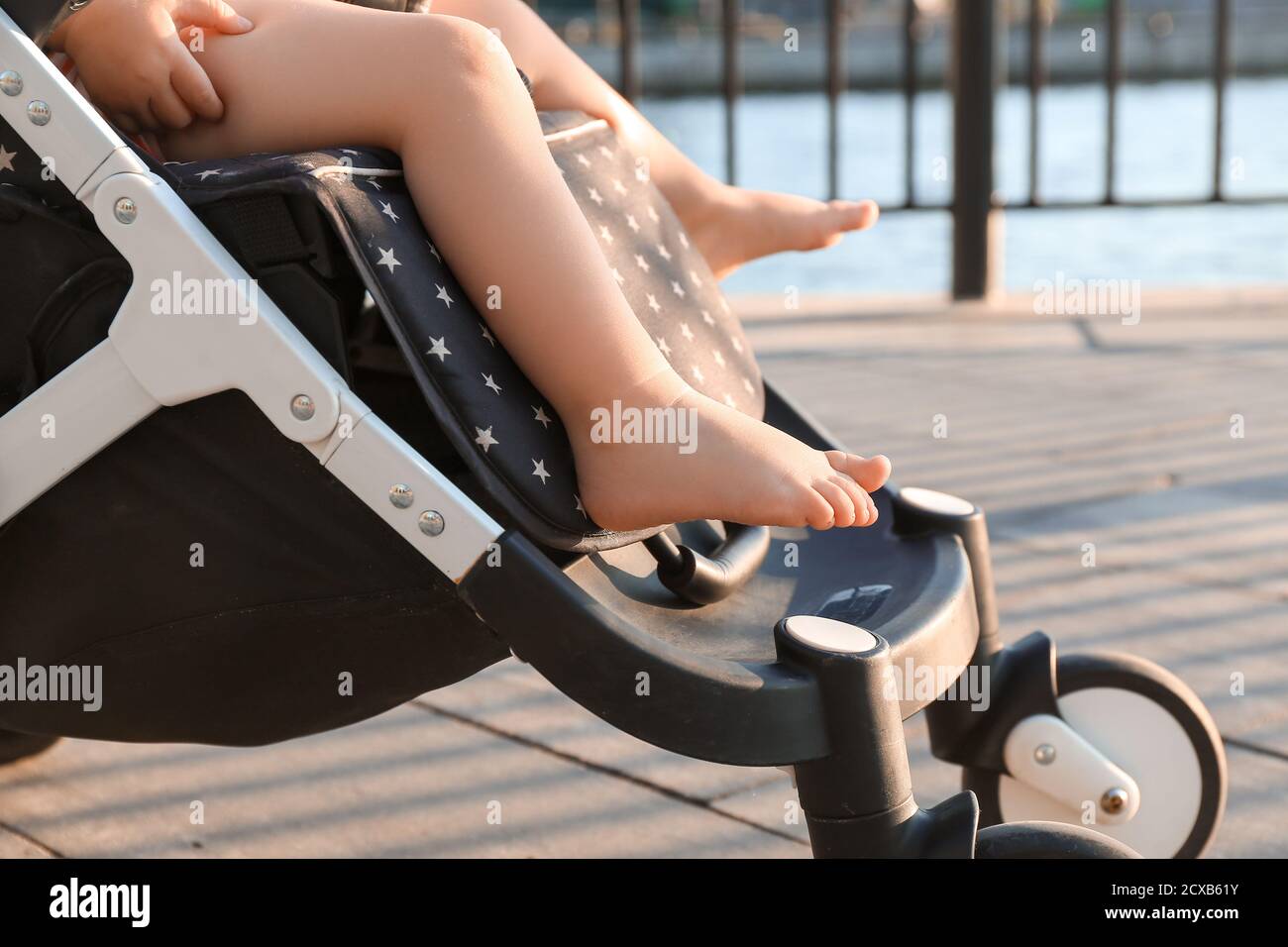Cute baby in stroller outdoors Stock Photo - Alamy