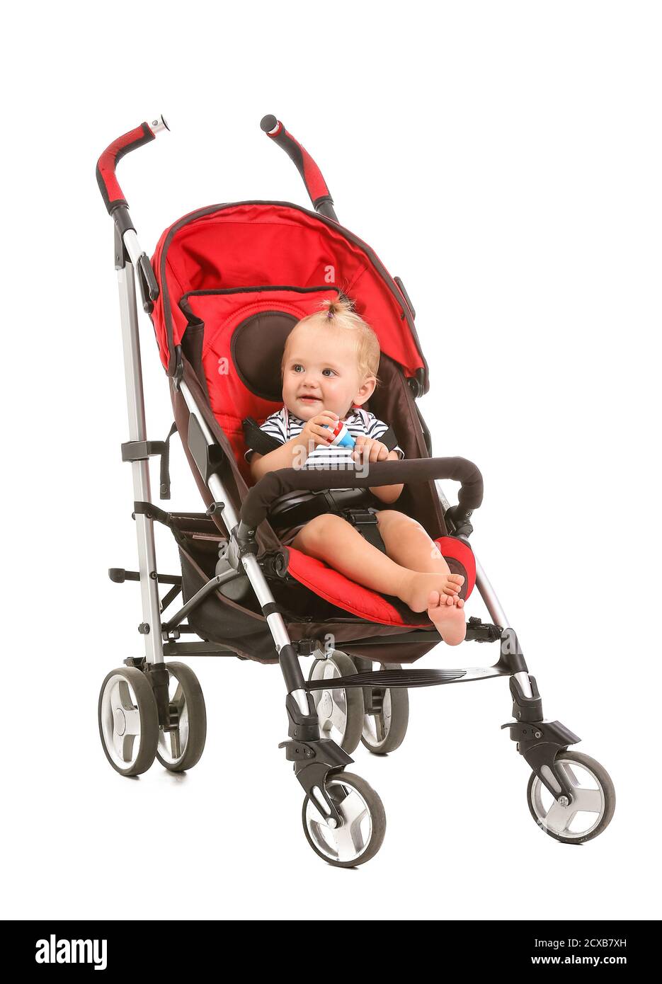 Cute little baby in stroller on white background Stock Photo - Alamy