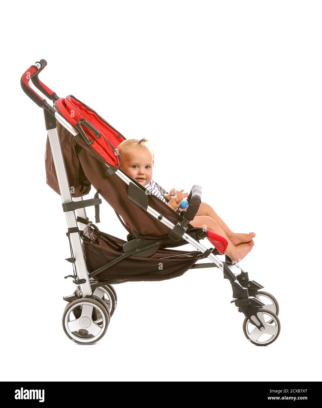 Cute little baby in stroller on white background Stock Photo - Alamy
