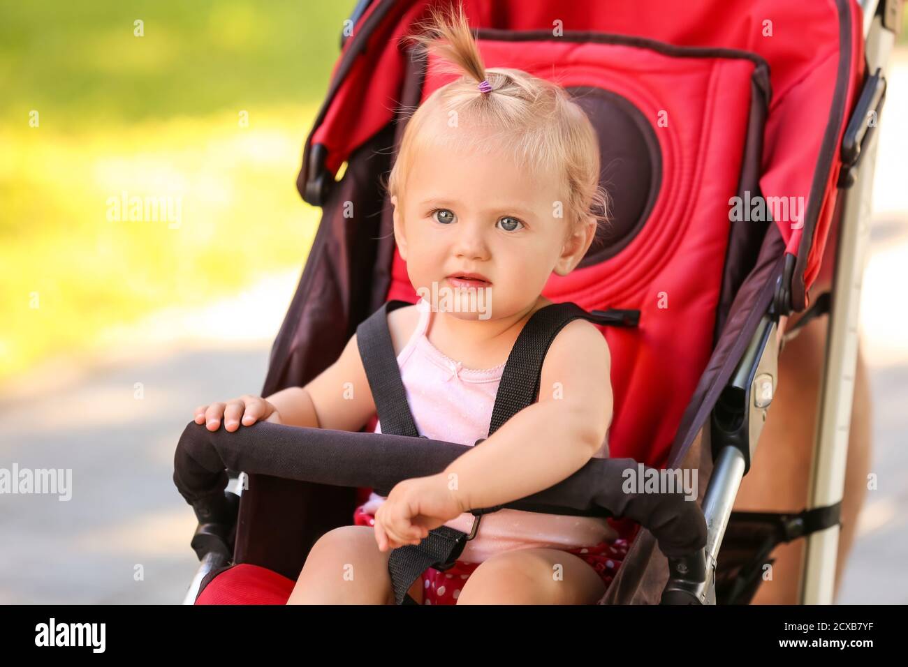 Cute baby in stroller outdoors Stock Photo - Alamy