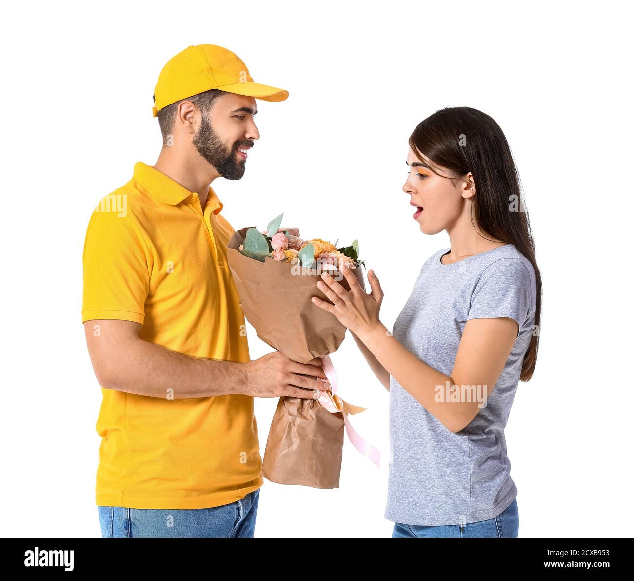 Young woman receiving bouquet of flowers from delivery man on white ...