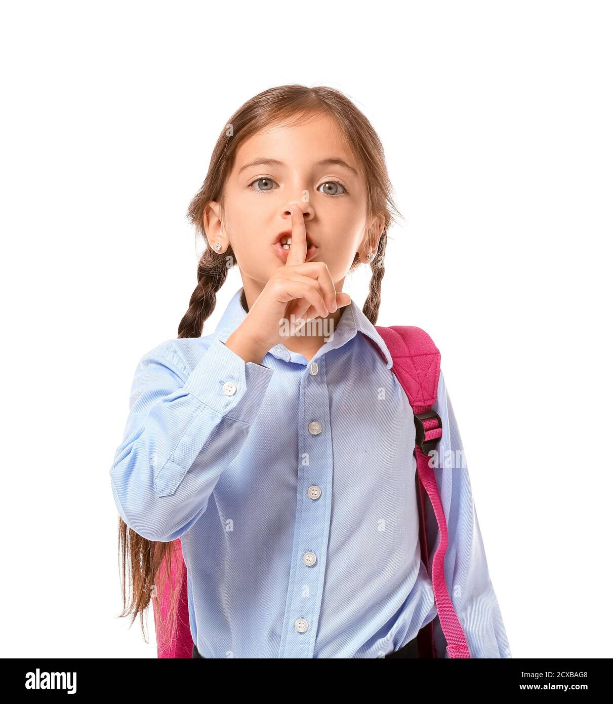 Little schoolgirl showing "silence" gesture on white background Stock ...