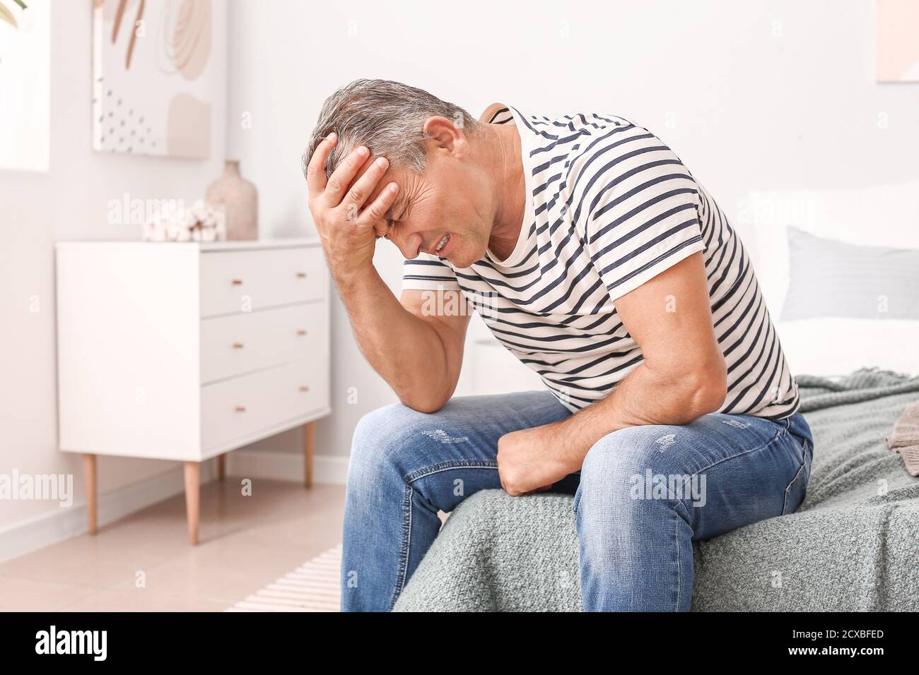 Stressed mature man at home Stock Photo - Alamy