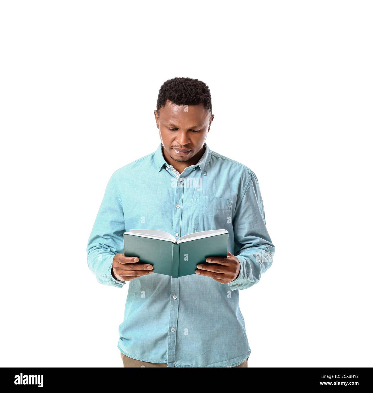 African-American man reading book on white background Stock Photo - Alamy