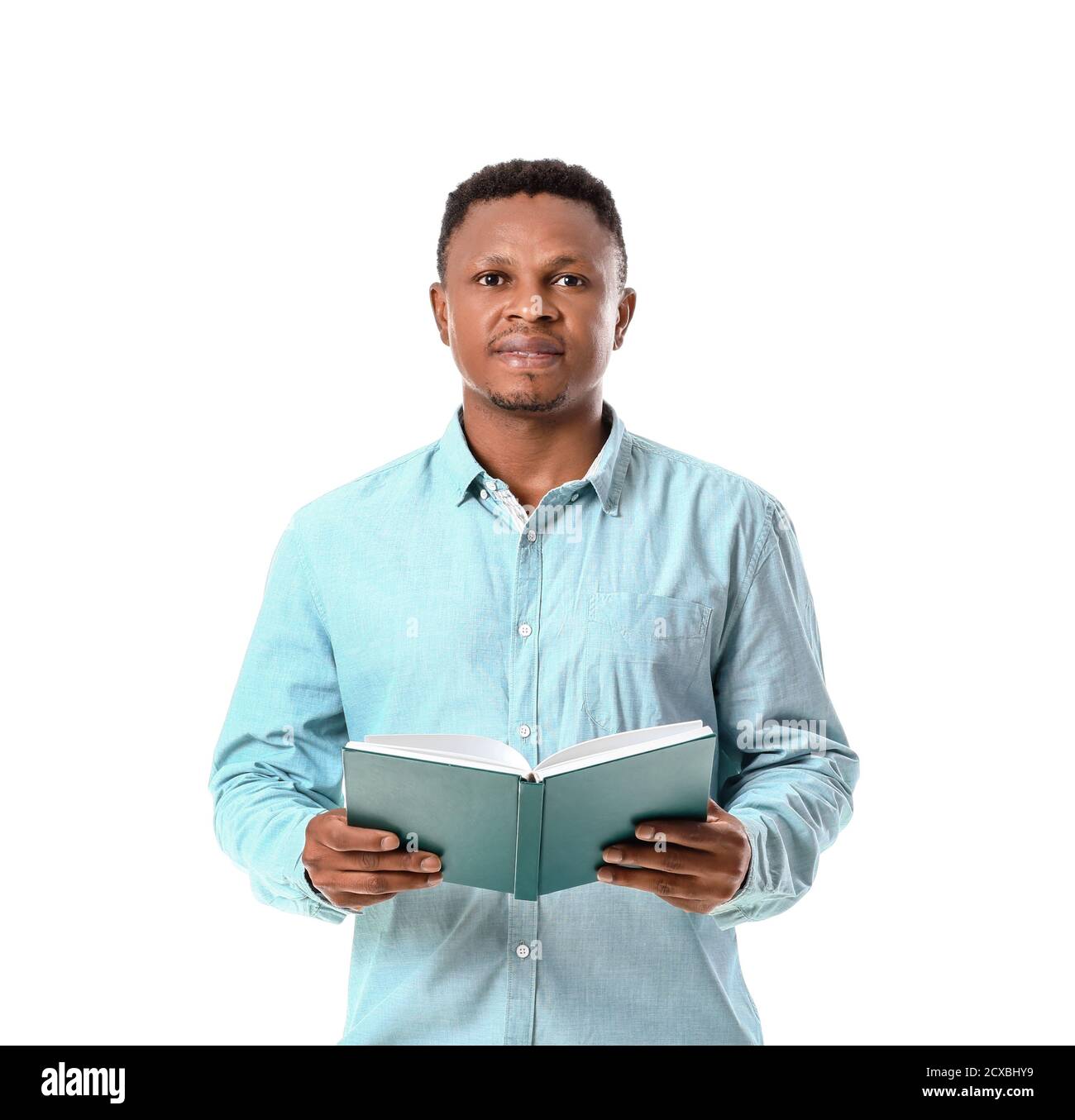 African-American man reading book on white background Stock Photo - Alamy
