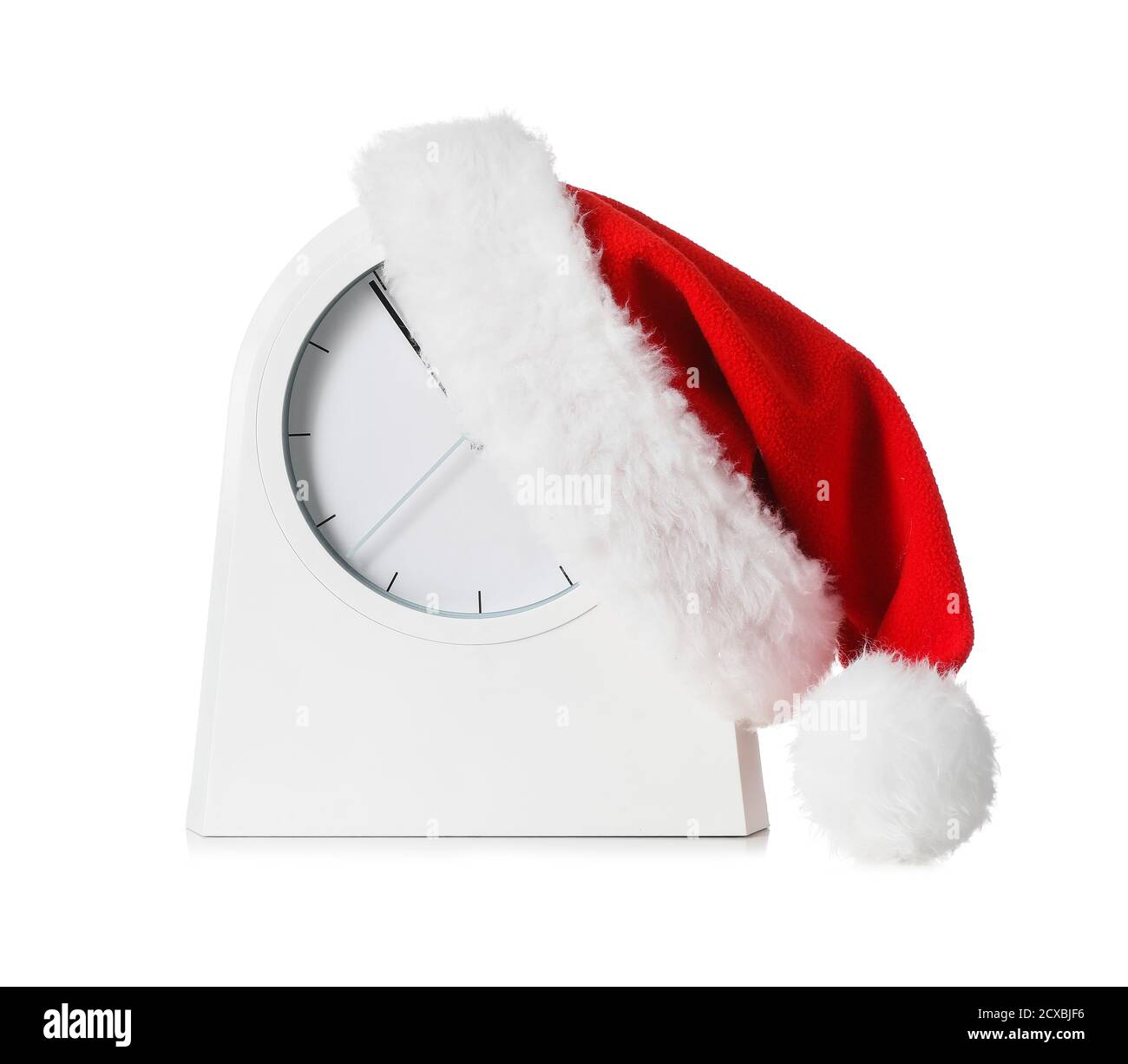 Santa Claus hat and clock isolated on white Stock Photo - Alamy