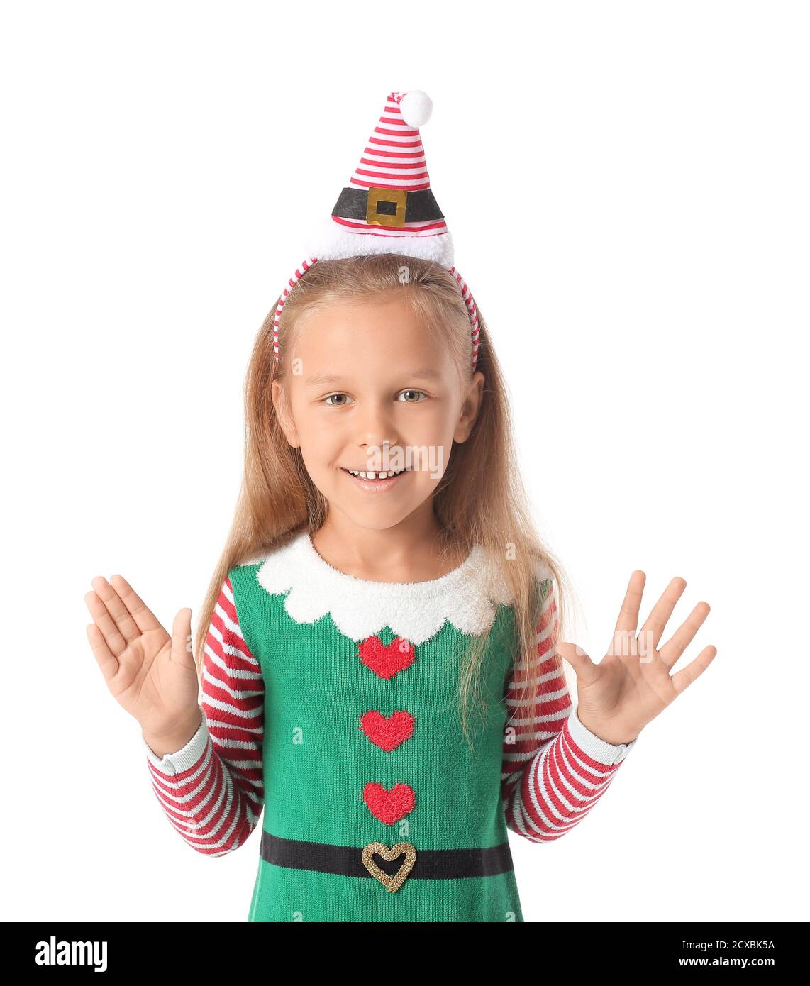 Cute little girl dressed as elf on white background Stock Photo - Alamy