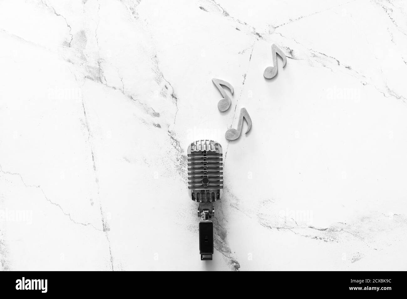 Retro microphone with music notes on white background Stock Photo - Alamy