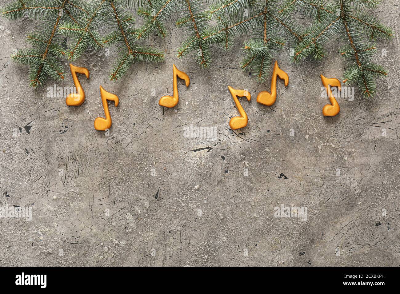 Christmas tree branches with music notes on grunge background Stock ...