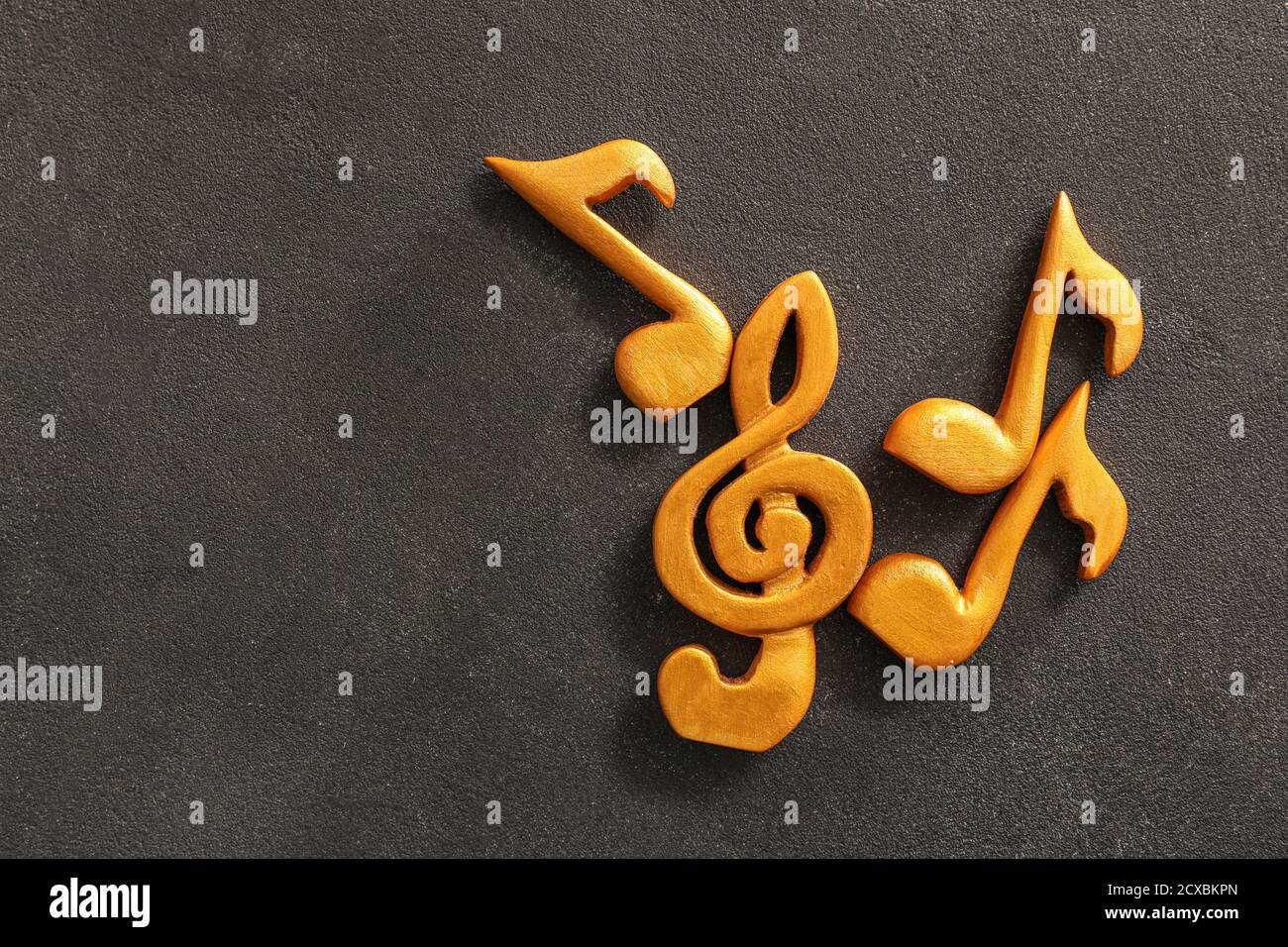 Music notes on dark background Stock Photo - Alamy