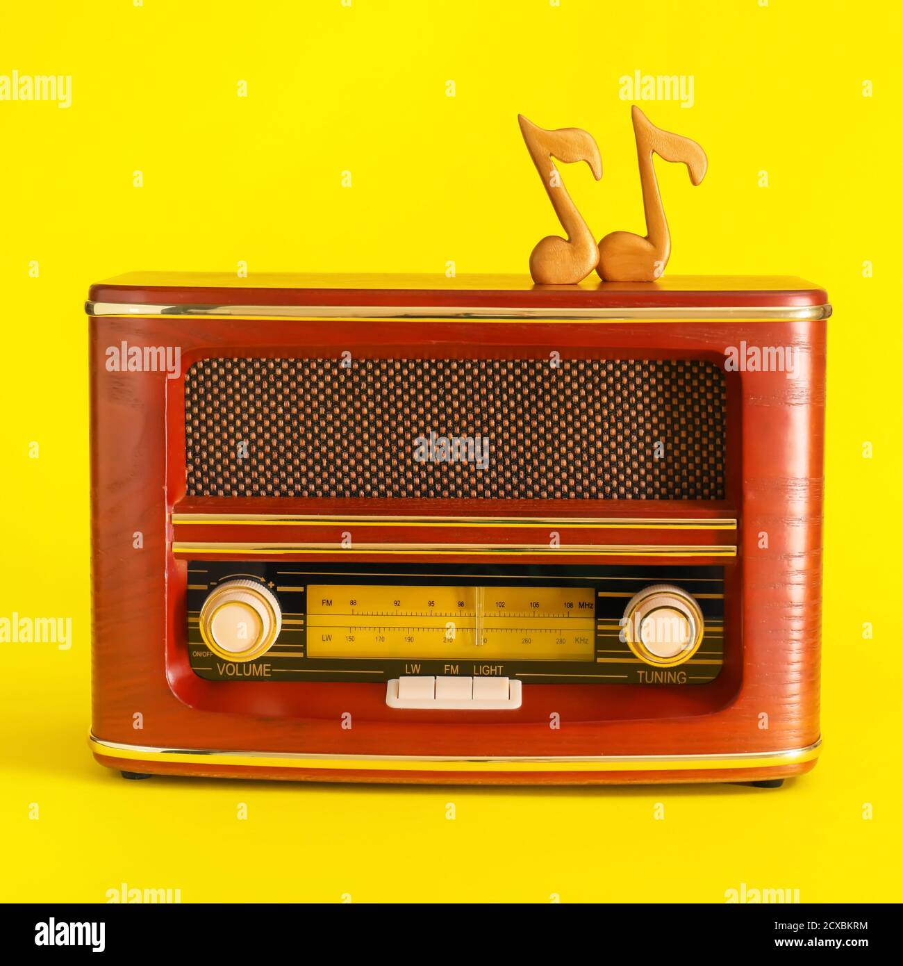 Vintage radio receiver with music notes on color background Stock Photo ...