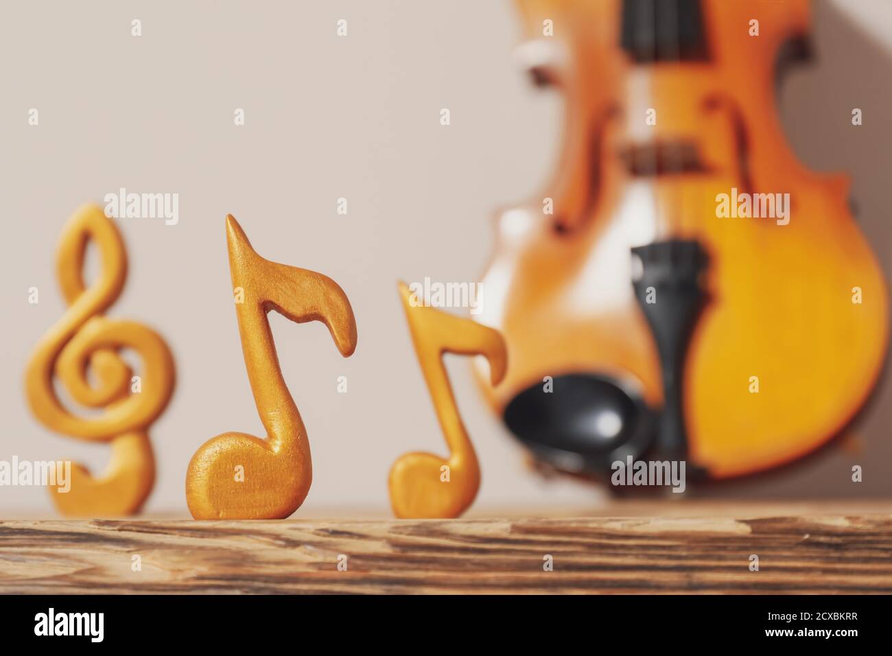 Music notes on wooden table, closeup Stock Photo - Alamy
