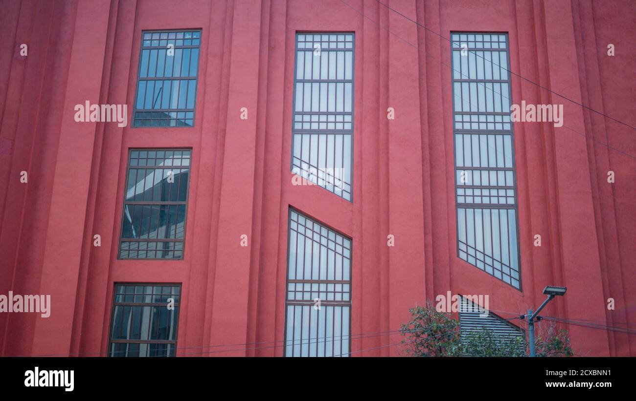 Long Vertical Windows on a Red Building Stock Photo - Alamy