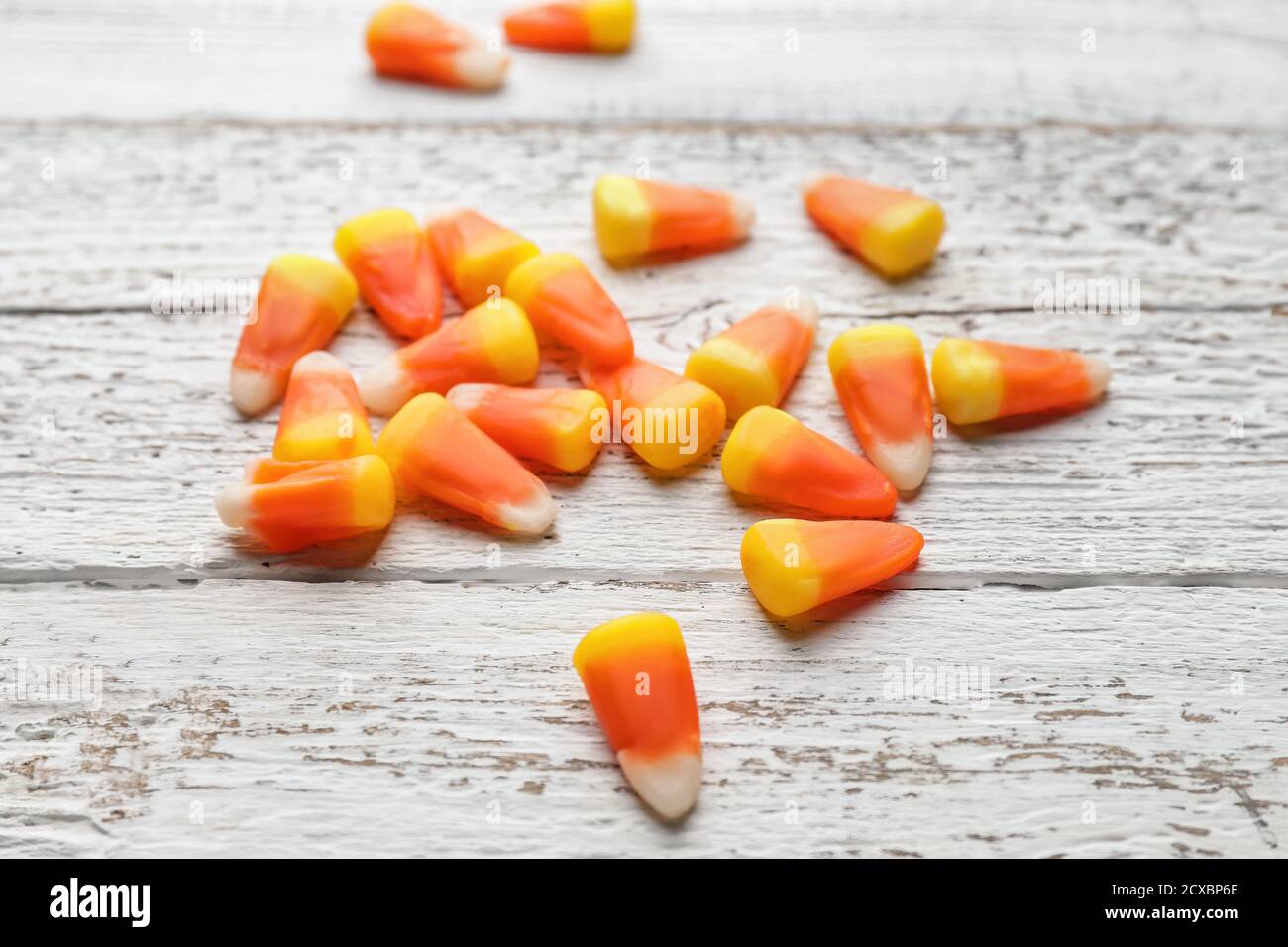 Tasty candy corns for Halloween on white wooden background Stock Photo ...