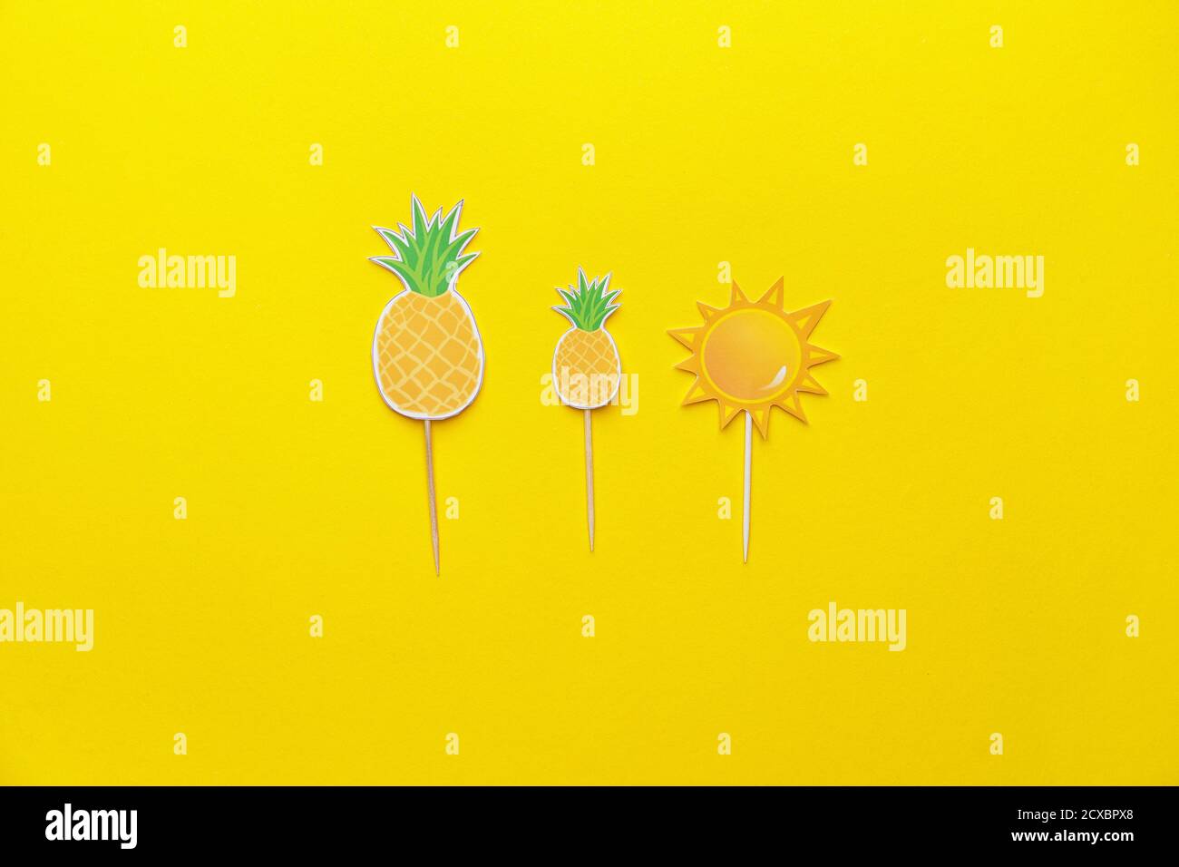 Stylish cupcake toppers on color background Stock Photo - Alamy