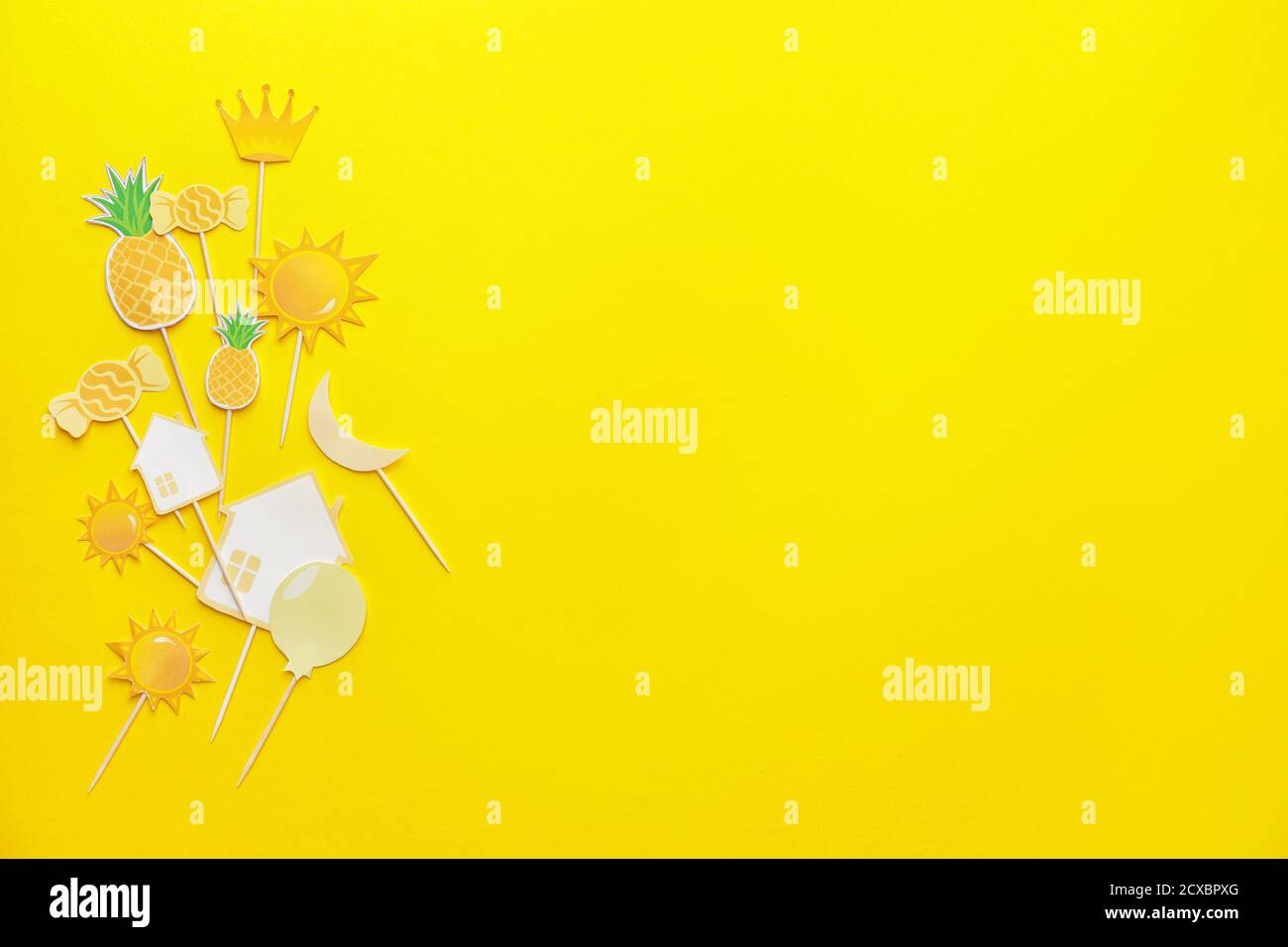 Stylish cupcake toppers on color background Stock Photo - Alamy