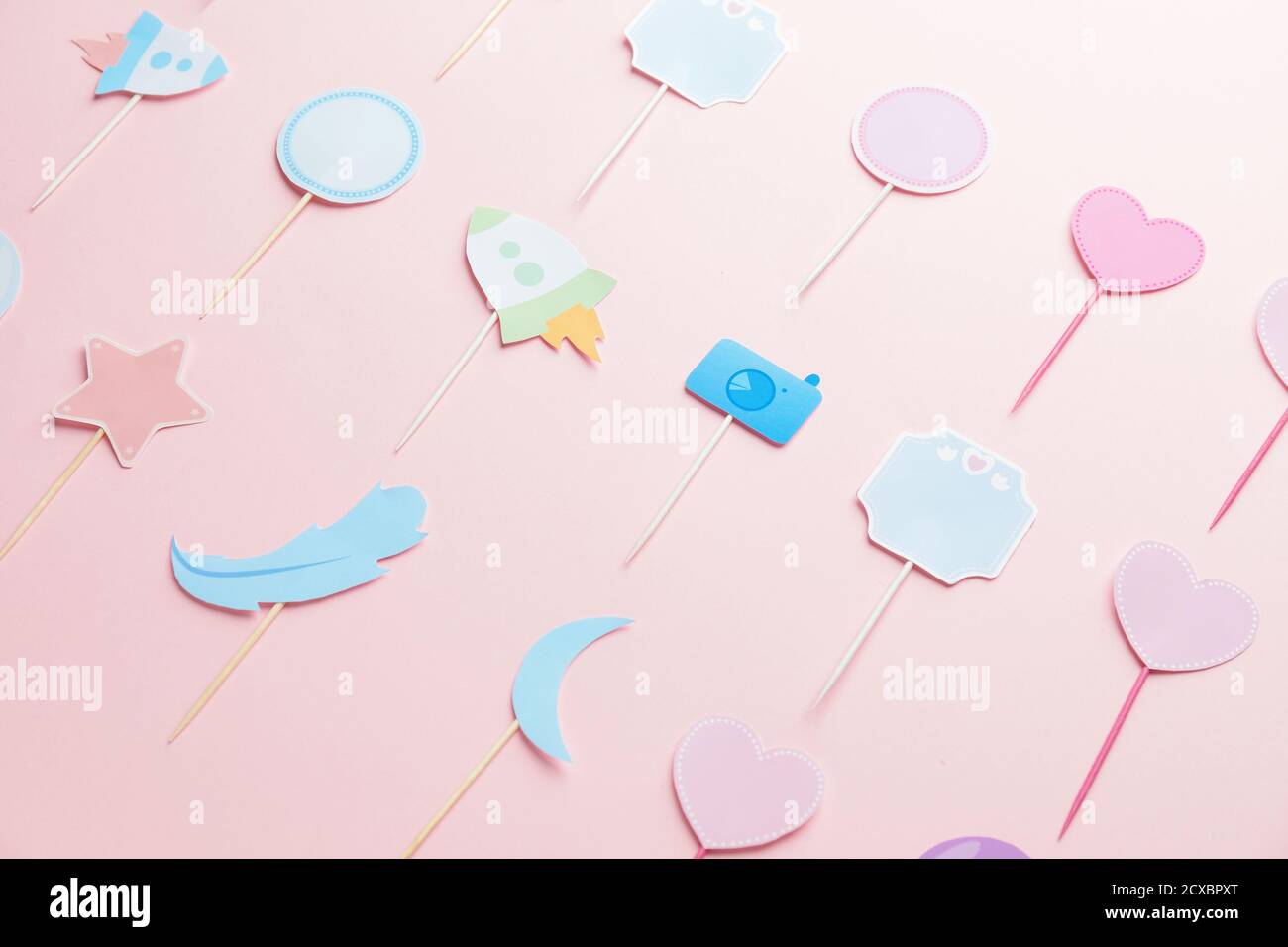 Stylish cupcake toppers on color background Stock Photo - Alamy