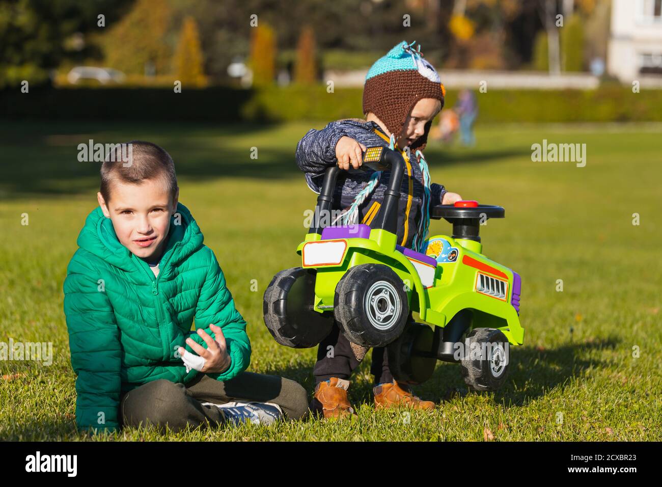 Two cheerful brothers-boys of different ages have fun playing with a ...